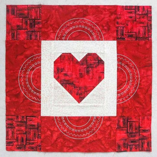 Piecing the heart together on this sweet Valentine-themed quilt
